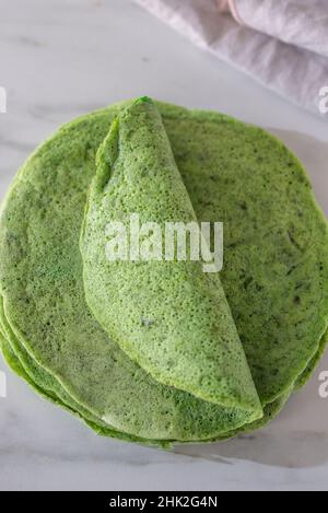 Delicious spinach crepes green colored pancake with vegetables Stock ...
