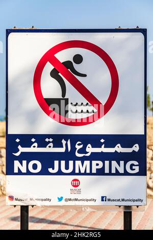 A sign in Arabic and English saying 'In case of fire do not use lifts ...