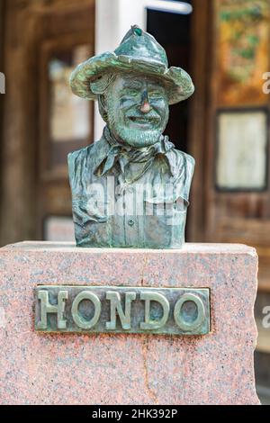 Luckenbach, Texas, USA. Statue of Hondo Crouch outside the post office ...