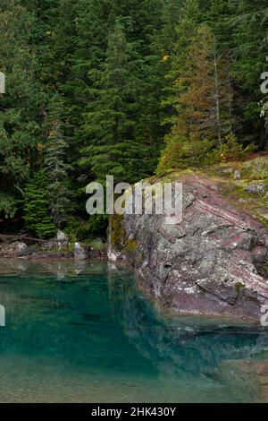 USA, Montana. Rocky outcrop, McDonald Creek, Glacier National Park ...