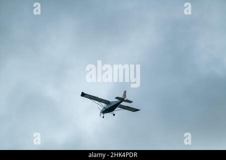 Small airplane against cloudless evening sky Stock Photo - Alamy