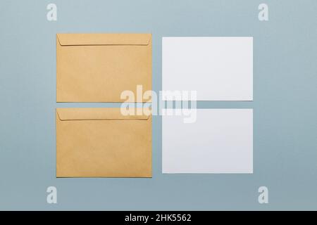 Two postcard mockups on blue background with craft envelopes. Card mock ...