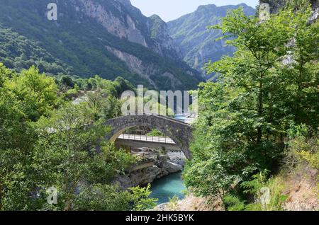 Greece, landscape with old and new bridge over Arachtos river in the ...