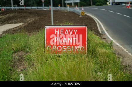 Heavy plant crossing road sign UK Stock Photo - Alamy