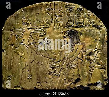 Ancient Egyptian stela depicting the god Amun receiving offerings at ...
