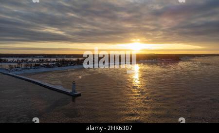 Beautiful Sunset Looking Over a Quiet Lighthouse Stock Photo - Alamy