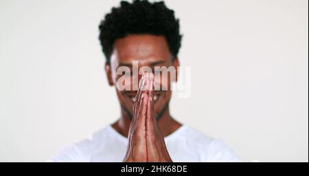 Compassionate black African man smiling camera giving thanks an d being ...