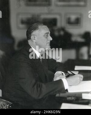 President Franklin D. Roosevelt is shown at his desk at the White House ...