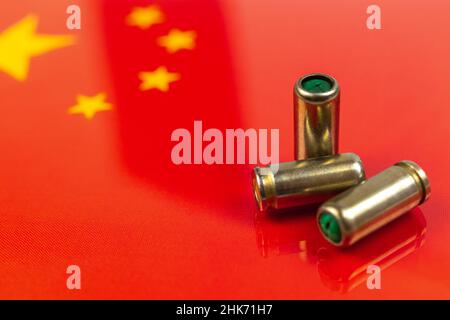 Gun bullets over the China flag. Criminal and corruption concept ...