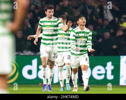 Celtic's Reo Hatate (right) celebrates scoring their side's second goal ...