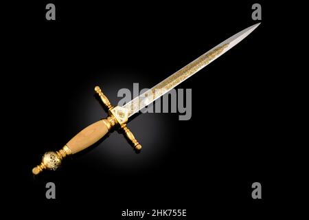 souvenir collectible silver gold dagger with scabbard on black. Luxury ...