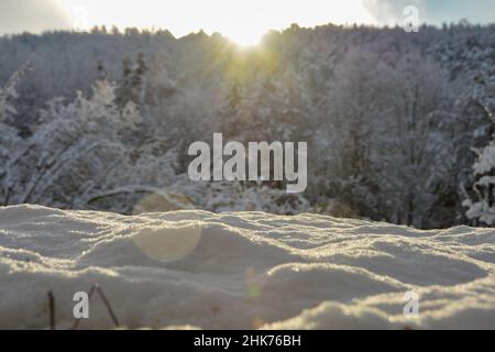 Sunrise over forest with a lot of snow in the foreground Stock Photo ...