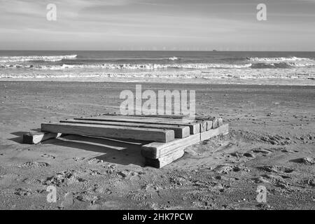 Heavy wooden raft washed up on a beach Stock Photo - Alamy