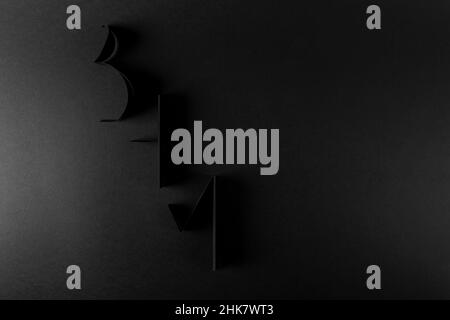 Paper alphabet letters BHM with shadow on black background. Black ...