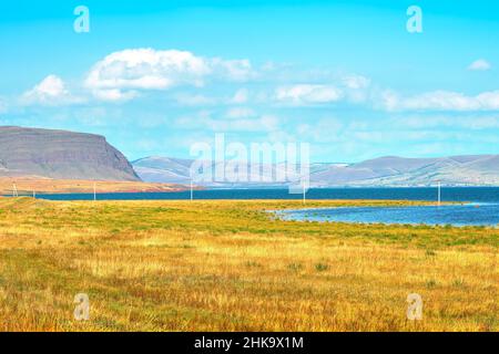 Steppe plain on the background of Mount Tepsey under a blue cloudy sky. Siberia, Russia Stock ...