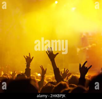 It's all about the fans. Shot of fans enjoying an outdoor music ...