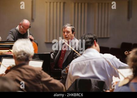American pianist and conductor, Murray David Perahia, conducting a ...