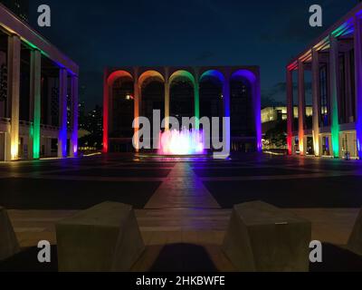 Rainbow colored lights illuminating the colonnade of Lincoln Center ...