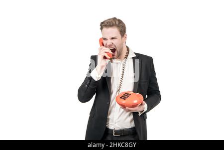 Line telephony. Angry man shout in telephone receiver. Businessman is ...