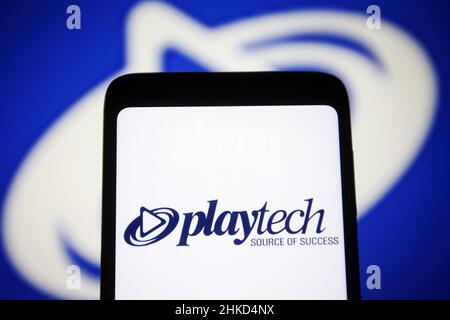 In this photo illustration, a Playtech company logo is seen displayed ...