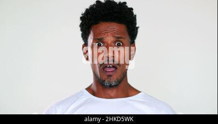 African american gradual shock reaction, face emotion black guy reacting with horror putting ...
