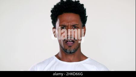 African man reacting shock surprise tense reaction face emotion Stock ...