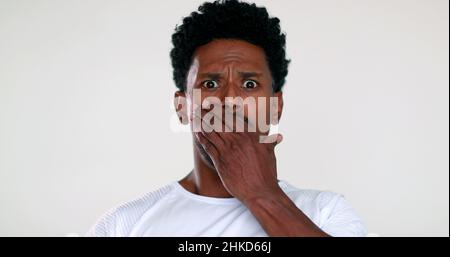 African man reacting with terror and horror to camera, black guy shock reaction Stock Photo - Alamy