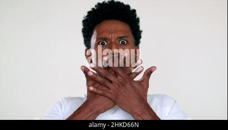 African man reacting with terror and horror to camera, black guy shock reaction Stock Photo - Alamy