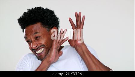 African man reacting with terror and horror to camera, black guy shock reaction Stock Photo - Alamy