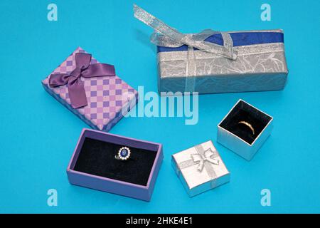 Open gift boxes with rings inside Stock Photo - Alamy