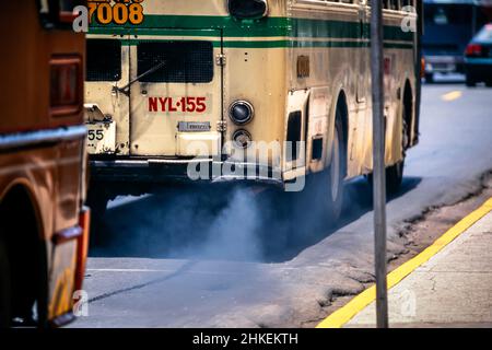 Exhaust smoke and fumes from bus in traffic on road in Manila ...