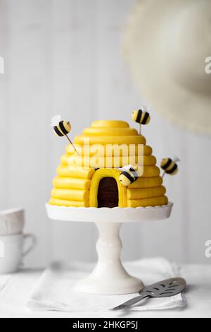 Beehive birthday cake with yellow buttercream and sugarpaste bees Stock ...