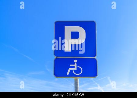 Big blue P sign for parking and parking sign for persons with ...