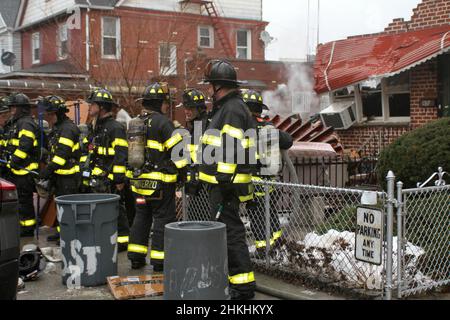 Emergency service personnel at the house Friday March 10, 2006, in ...
