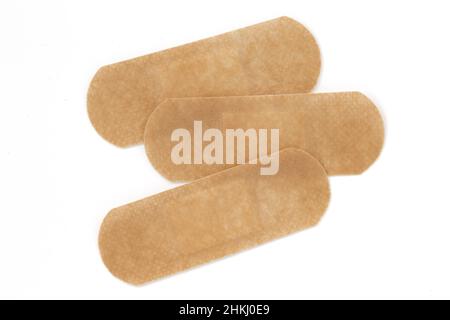 Medical bandages with sticking plaster, isolated on white Stock Photo ...