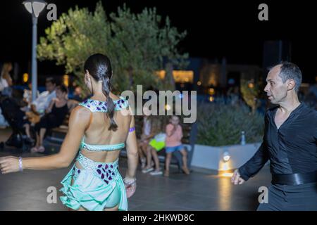 Showing beautiful dancers performing in front of tourists with ...