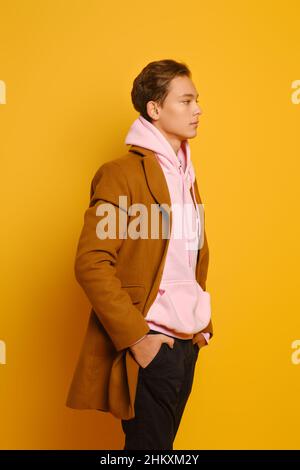 Caucasian man standing over pink background smiling confident pointing ...