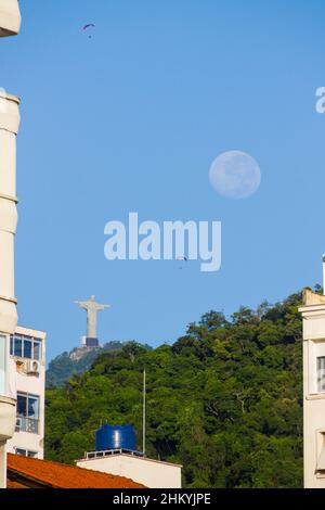 Christ the Redeemer and the Moon seen from Copacabana in Rio de Janeiro ...