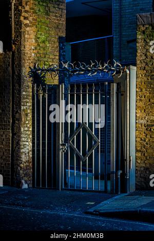 Spiky gate at an industrial site, London, SE1, England, UK Stock Photo ...