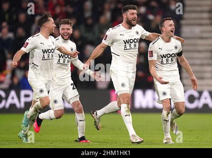Boreham Wood's Mark Ricketts, right, celebrates with teammates after ...