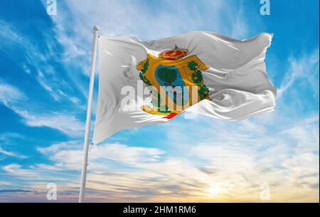 flag of Durango , Mexico at cloudy sky background on sunset, panoramic ...