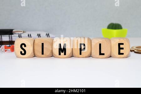 SIMPLE word made with building blocks isolated on white Stock Photo - Alamy
