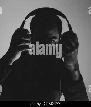 Young hispanic man angry playing video game at home Stock Photo - Alamy