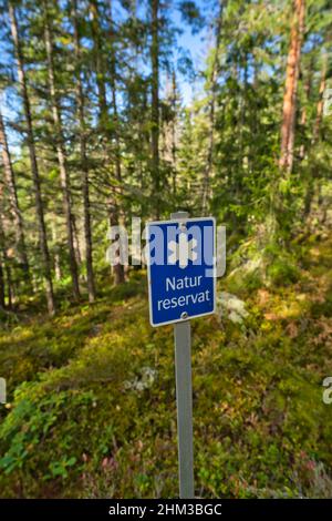 Nature reserve sign in front of forest Stock Photo - Alamy
