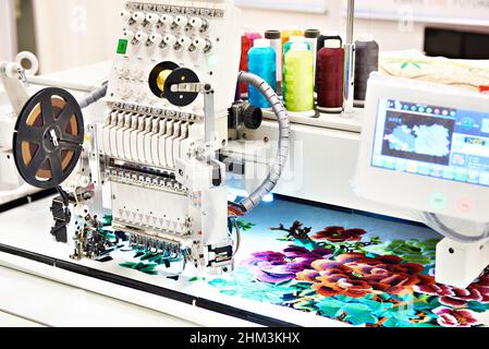 Embroidery industrial machine in sewing workshop Stock Photo - Alamy