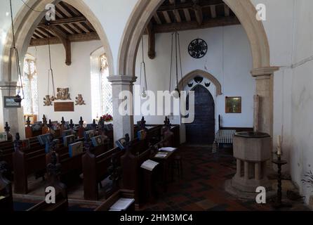 Sexton's wheel mounted about door, Yaxley church, Suffolk, England, UK ...