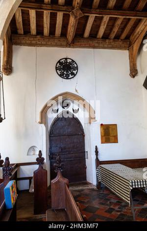 Sexton's wheel mounted about door, Yaxley church, Suffolk, England, UK ...