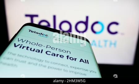 Smartphone with logo of American telemedicine company Teladoc Health ...