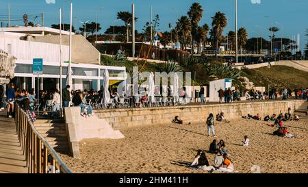 Parede, Cascais, Portugal - February 5, 2022: People enjoy a warm ...