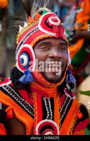 Street performer in traditional attire during carnival in the ...